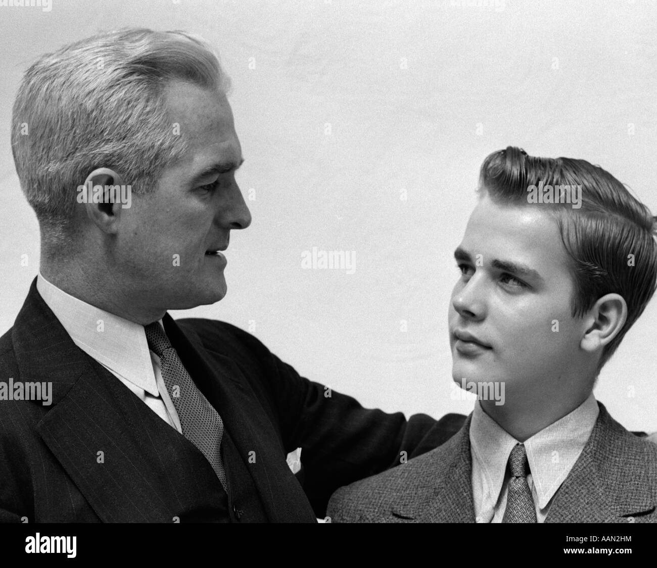 1940s MAN AND BOY FATHER SON WEARING SUITS FATHER'S ARM AROUND BOY ...