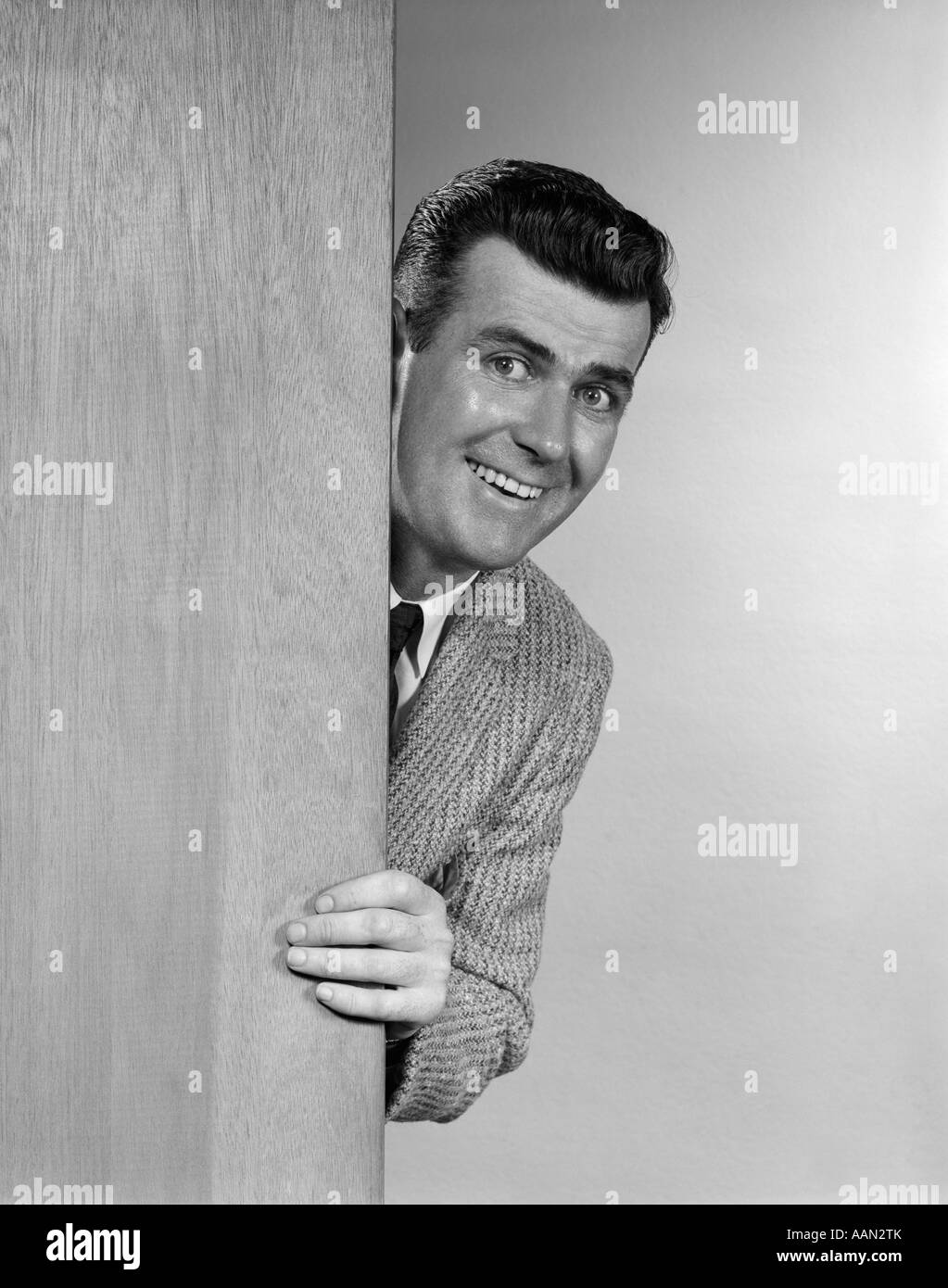 Smiling man looking out Black and White Stock Photos & Images - Alamy