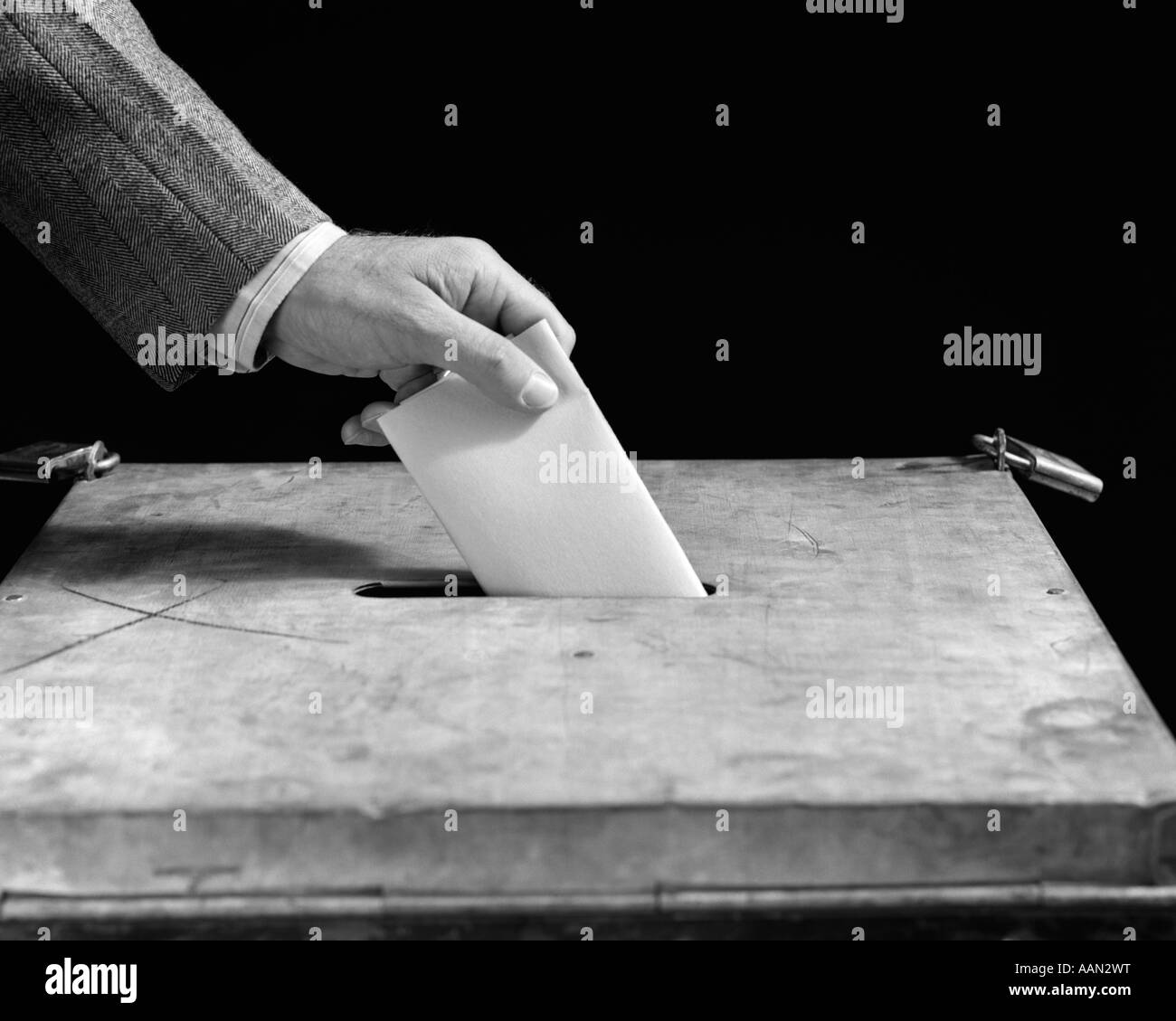 1930s 1940s MALE HAND DROPPING PAPER BALLOT IN VOTING BOX Stock Photo ...