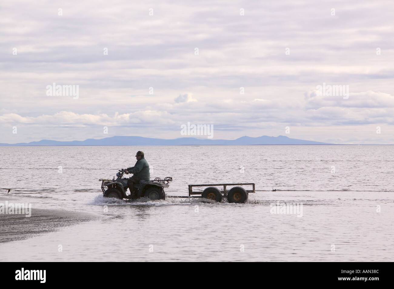 Eskimo hunter on quad bike Shishmaref Alaska an island Inuit community ...