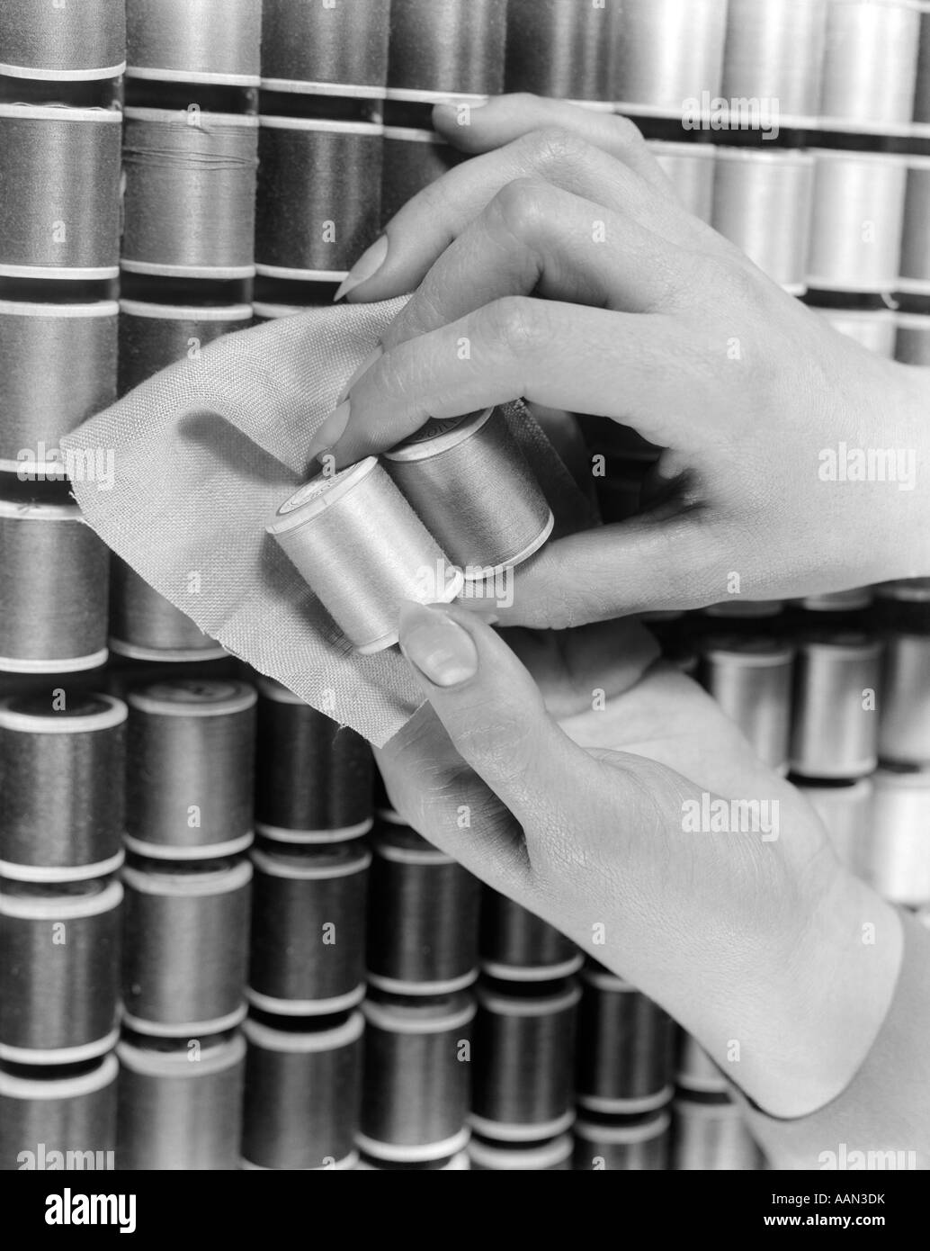 1930s 1940s HANDS WOMAN MATCHING SPOOL OF THREAD TO SWATCH OF MATERIAL ...