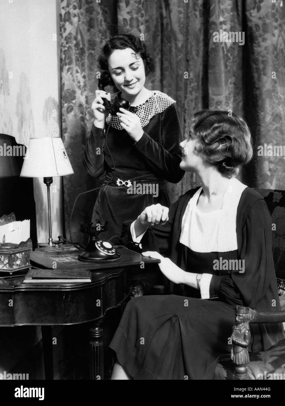 Two women talking one Black and White Stock Photos & Images - Alamy