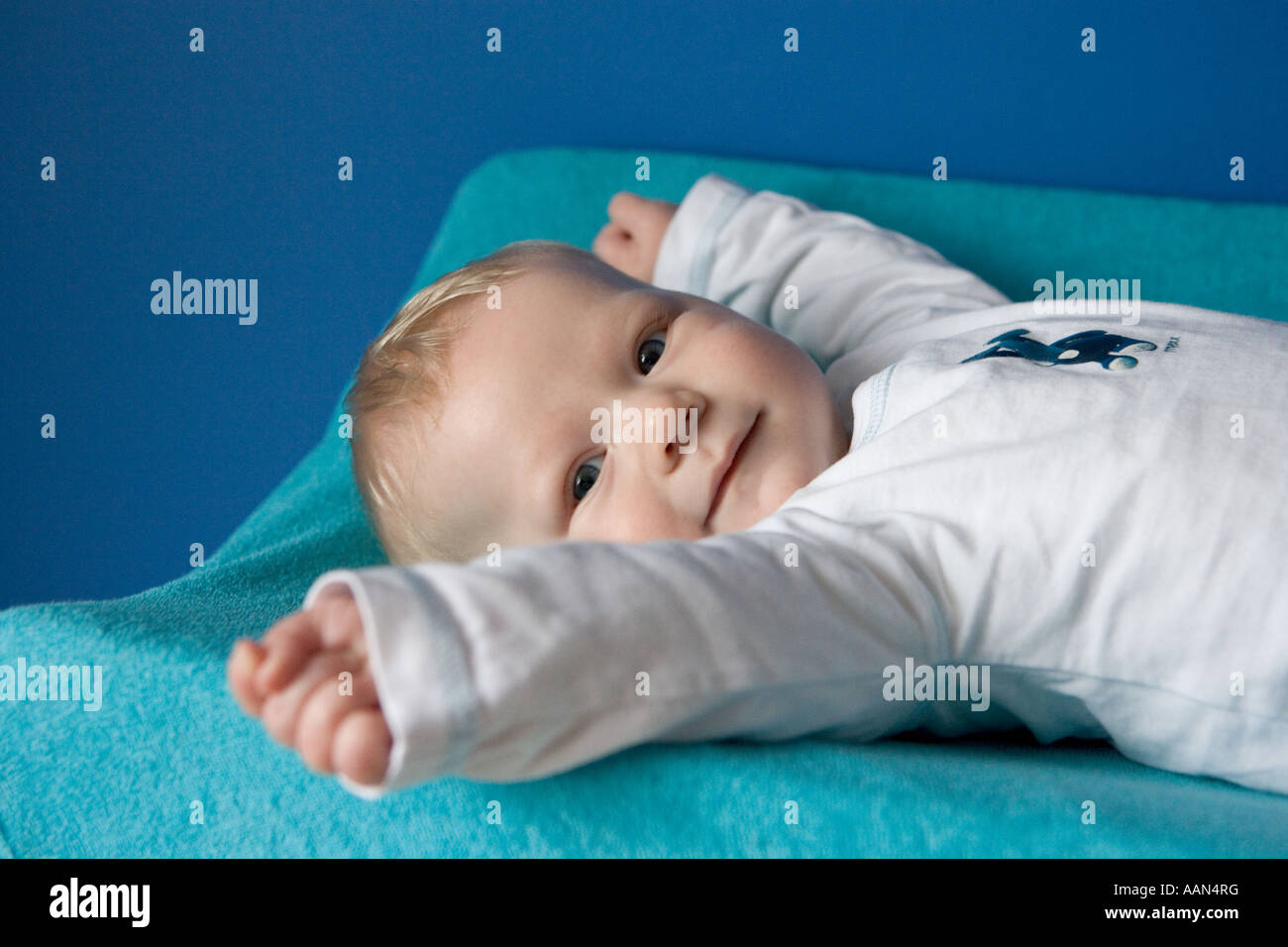 Baby stretches his arms Stock Photo - Alamy