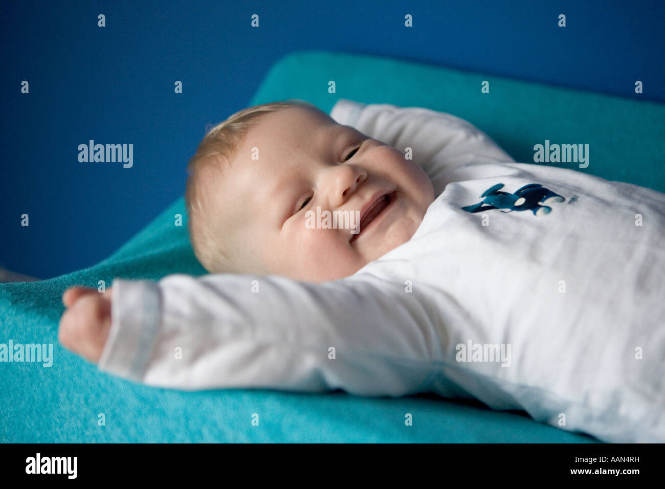 Baby stretches his arms Stock Photo - Alamy