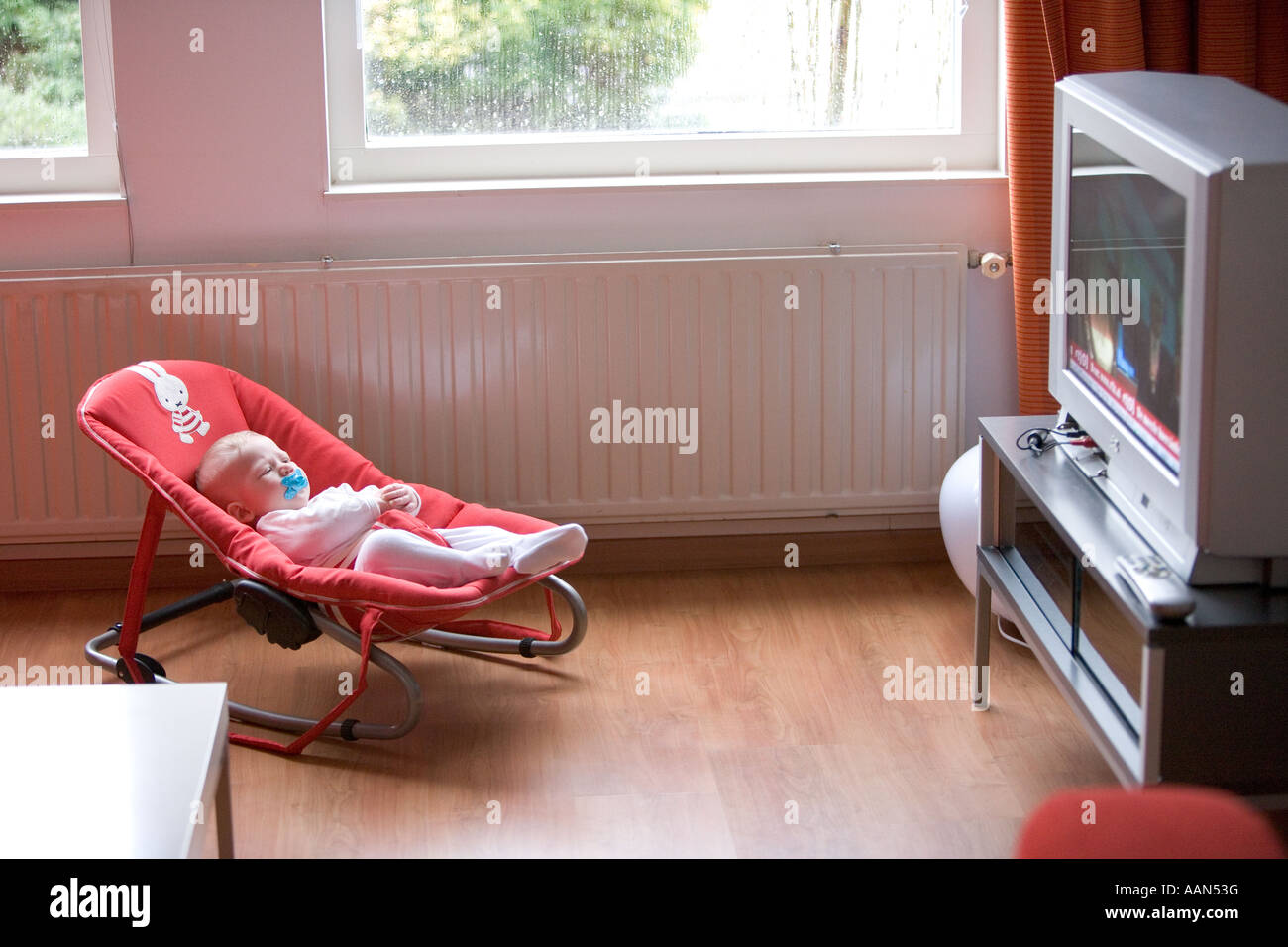 Newborn baby watches television Stock Photo - Alamy