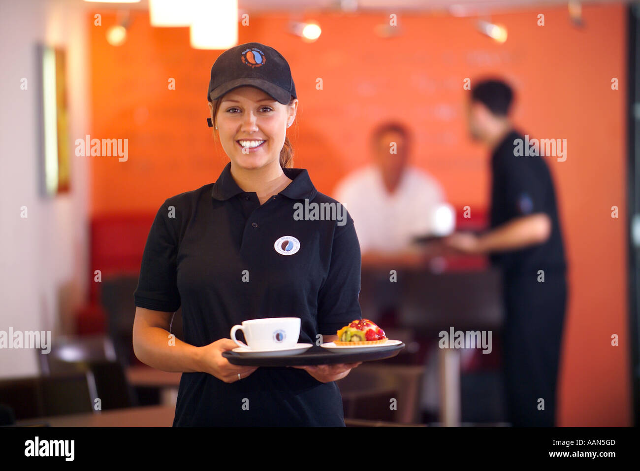 Portrait of waitress working in a modern coffee shop Stock Photo - Alamy