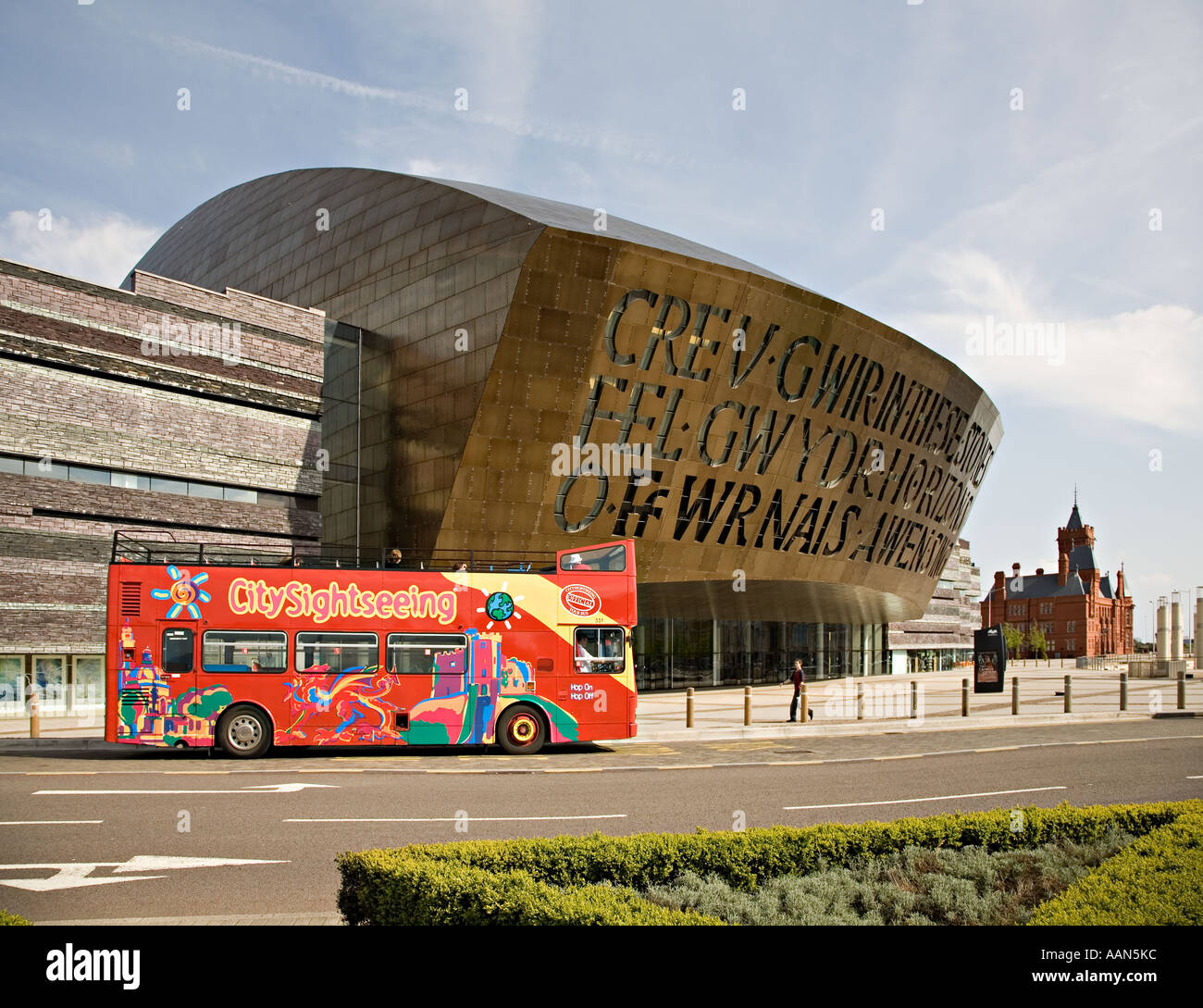 Millennium dome and Pierhead building with a double decker sightseeing ...