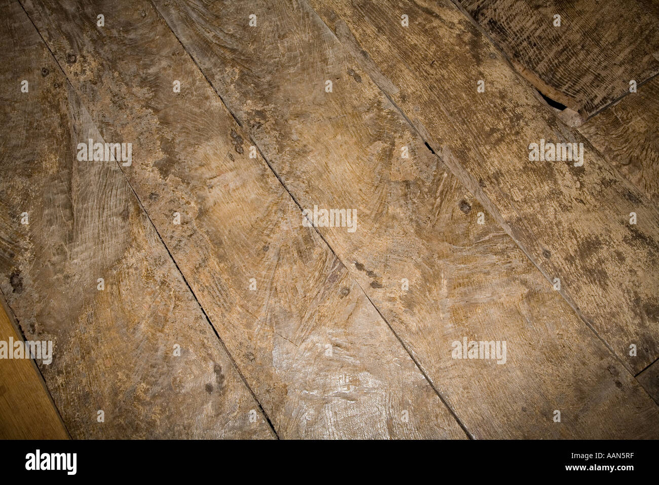 Worn old 15th century oak floorboards in manor house Treowen Wales UK ...