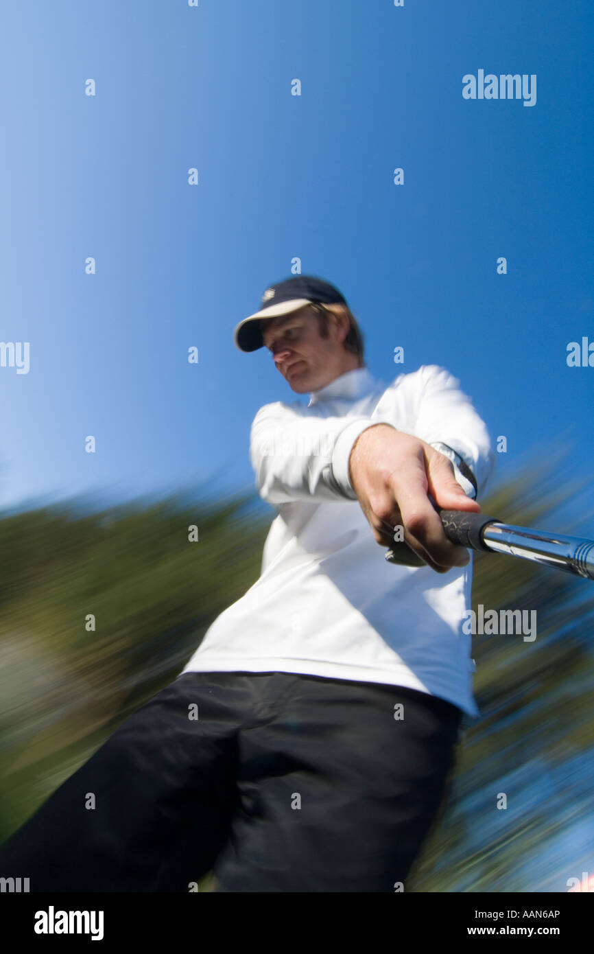a golfer in action Stock Photo - Alamy