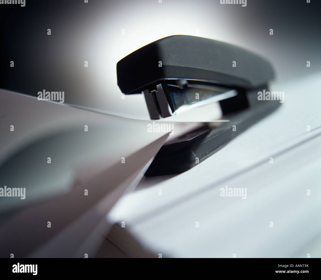 stapler with paper Stock Photo - Alamy