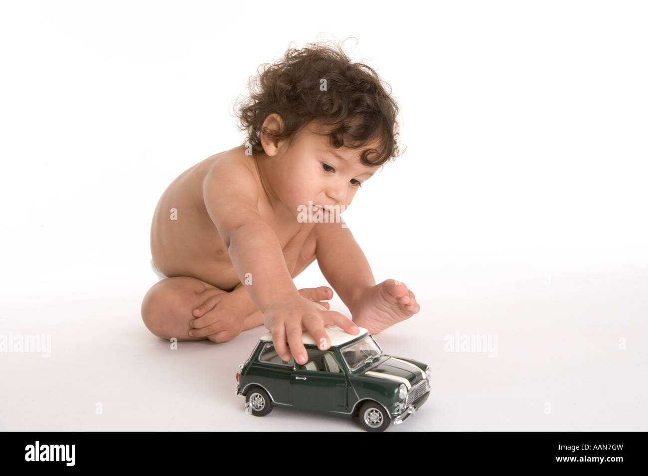 Little boy playing with toy car on the floor Stock Photo - Alamy