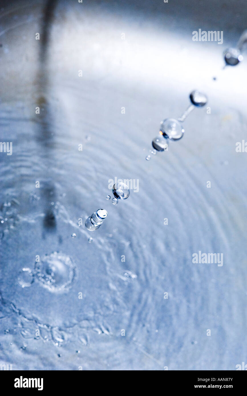 falling drops of water using high speed flash lighting Stock Photo - Alamy