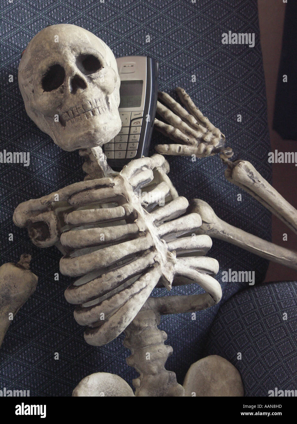 Skeleton With Cell Phone Stock Photo - Alamy