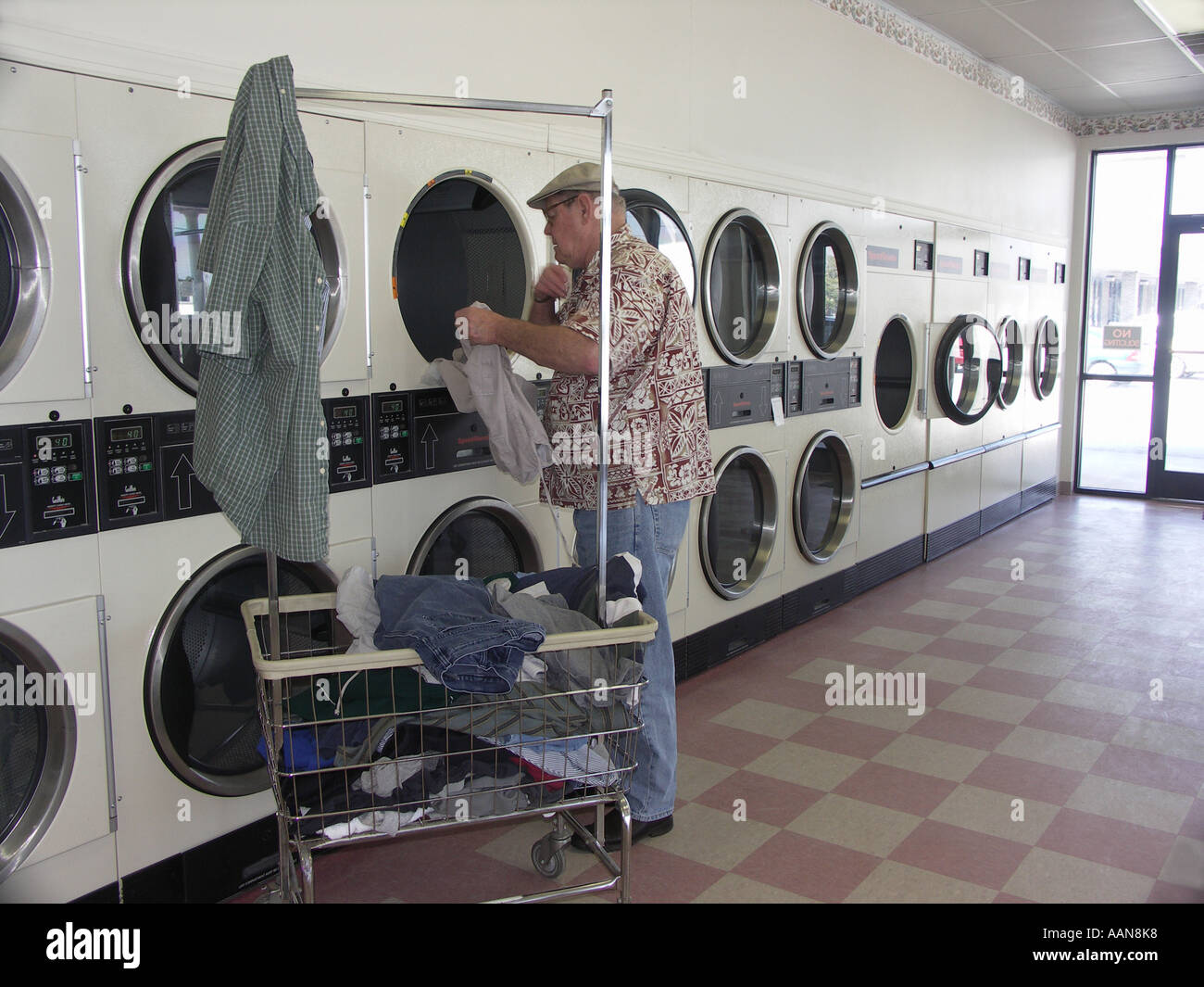 Removing clothes from dryer hi-res stock photography and images - Alamy