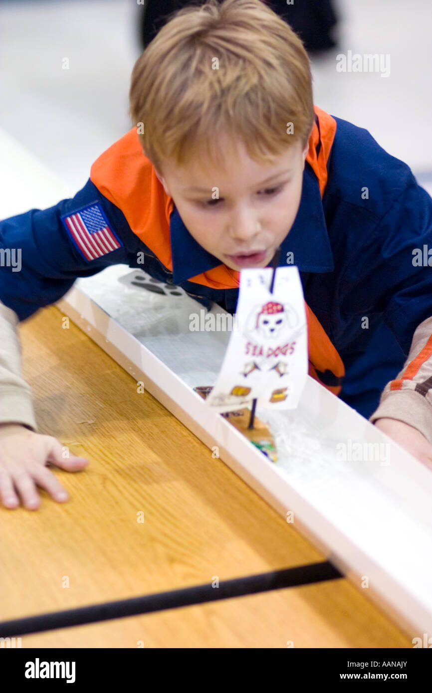 Cub Scout age 6 blowing his boat forward. The Raingutter Regatta St ...