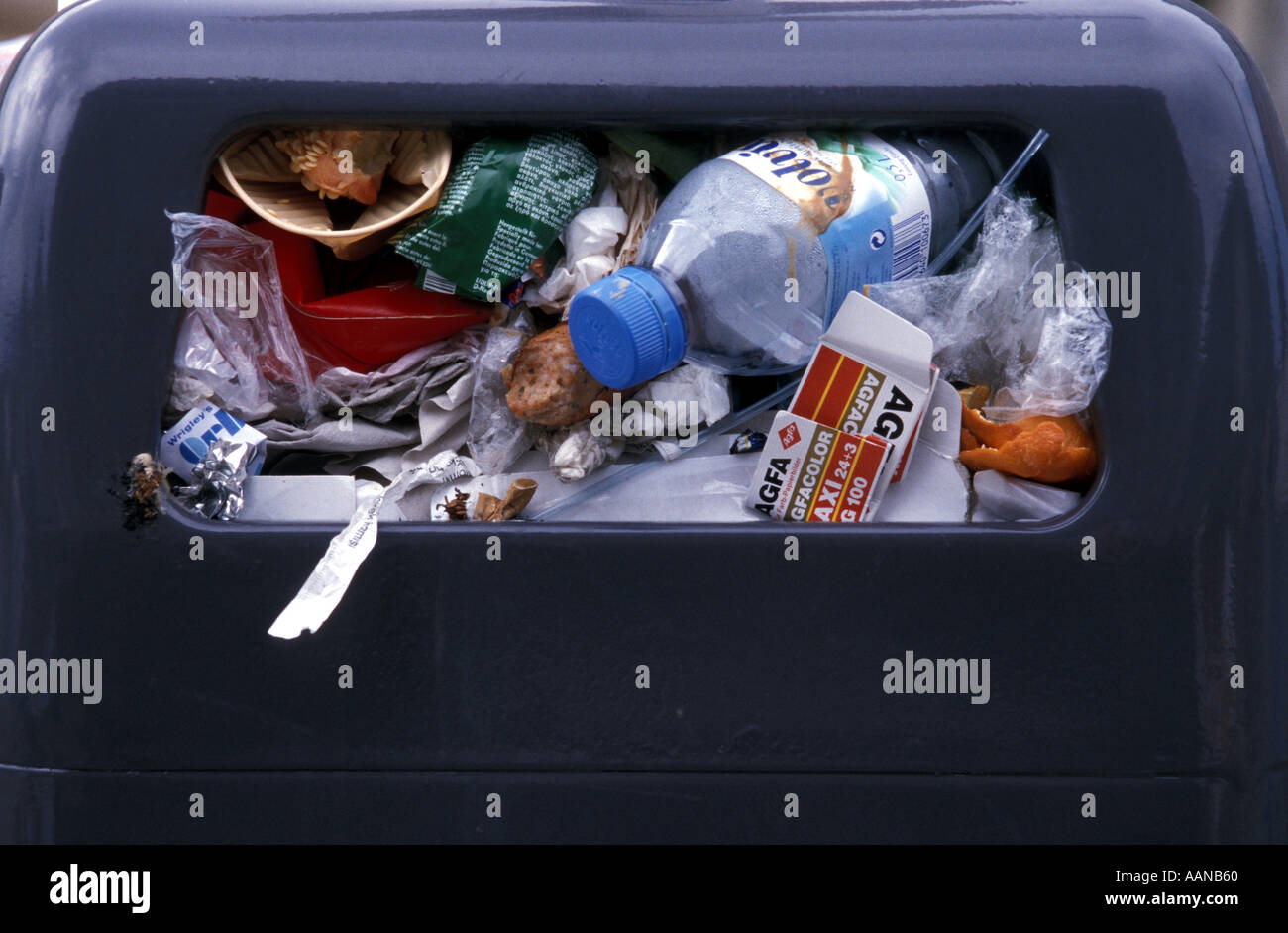 over flowing rubbish bin Stock Photo - Alamy