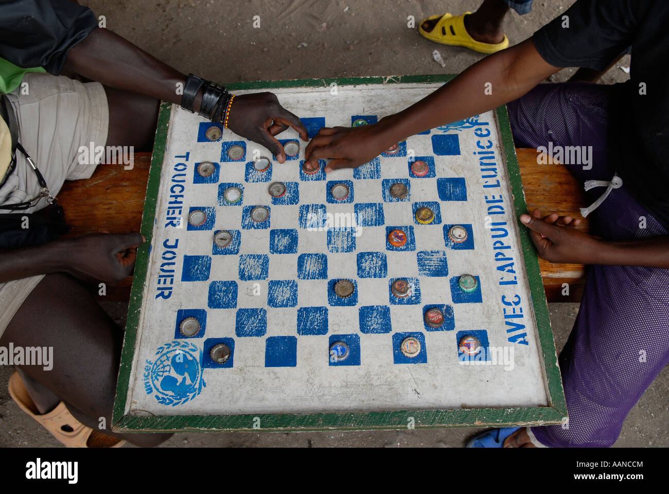 Former child soldiers play checkers board game at a rehabilitation ...