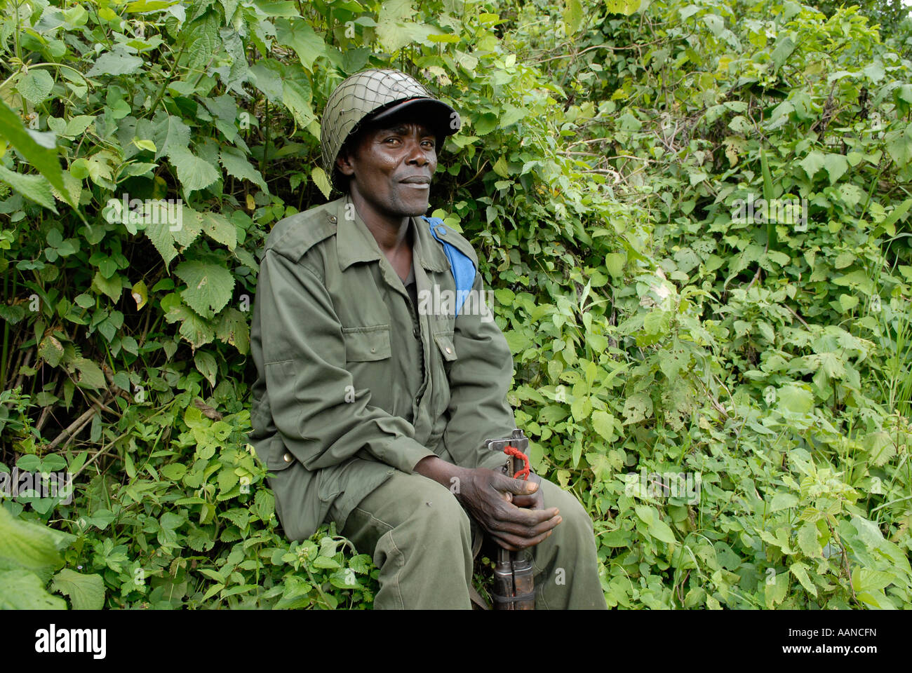 A FARDC Congolese government soldier stands guard with a Kalashnikov AK ...
