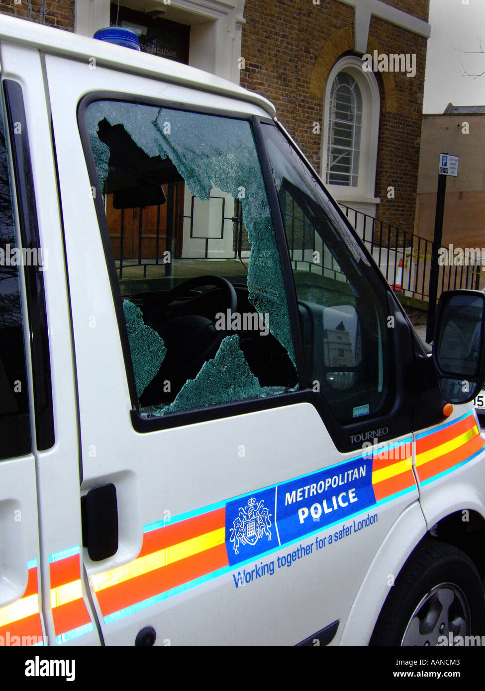 Broken police window Stock Photo - Alamy