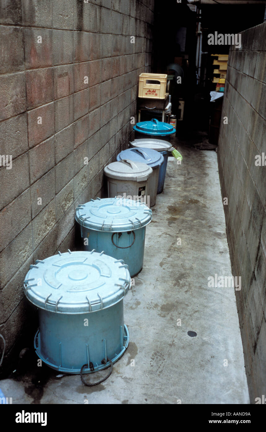 Garbage Cans Lining up Stock Photo - Alamy