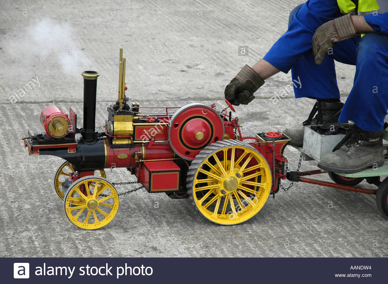 A minature steam Engine with driver Stock Photo - Alamy