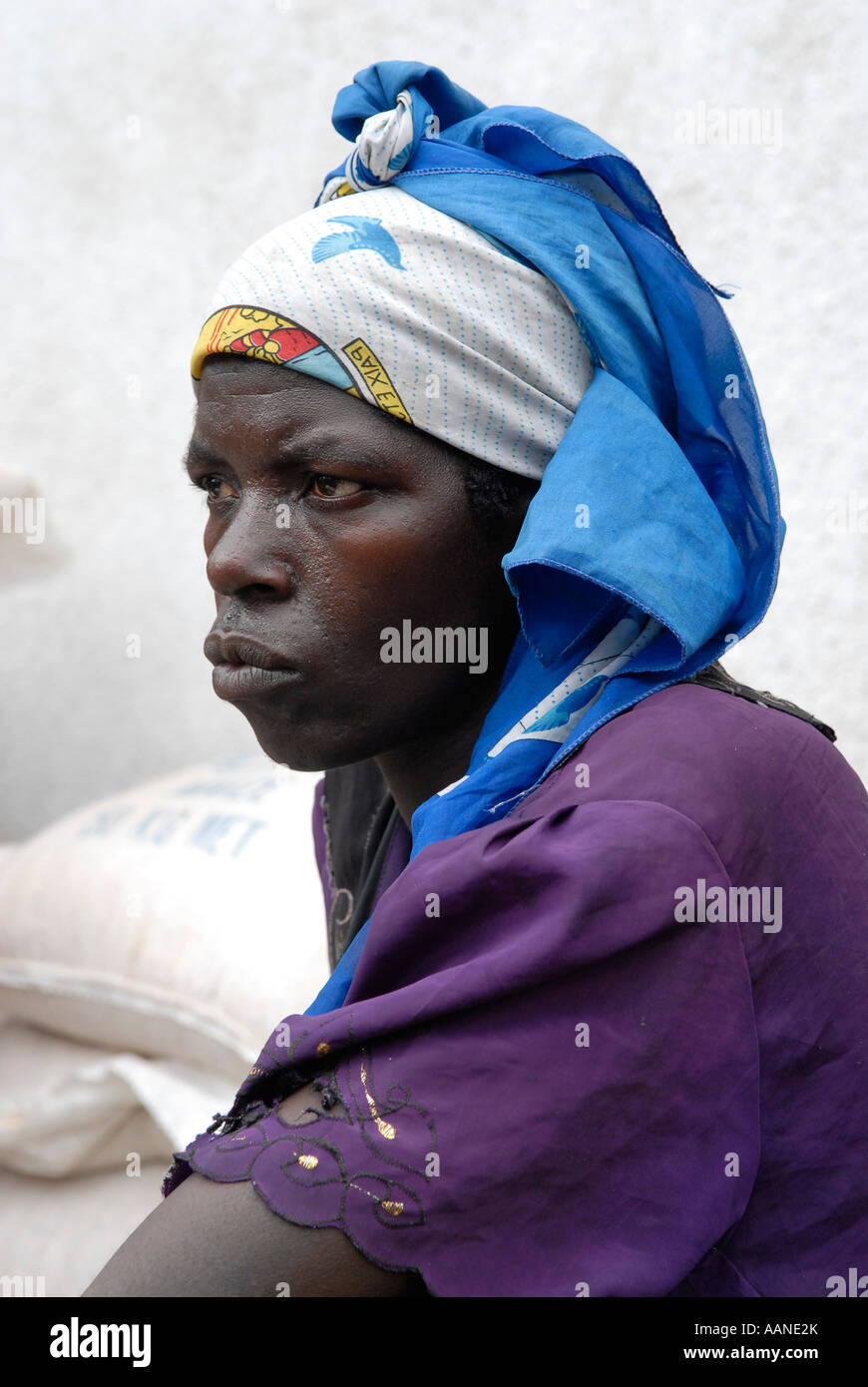 A displaced Congolese woman looks dejected during UN WFP food ...