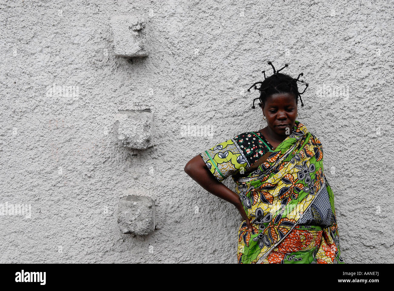 A woman with a traditional threading hairstyle wherein the hair is ...