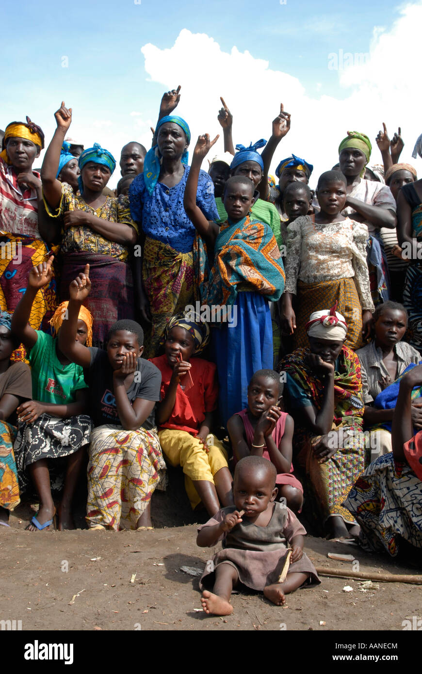 Displaced Congolese people raise their hands in an IDP camp in North ...