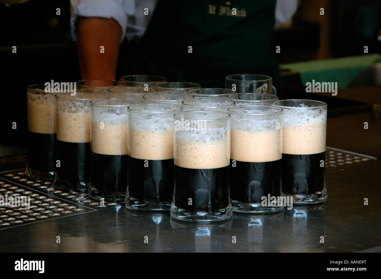 Strong dark draught beer served in large glasses at U Fleku bar ...