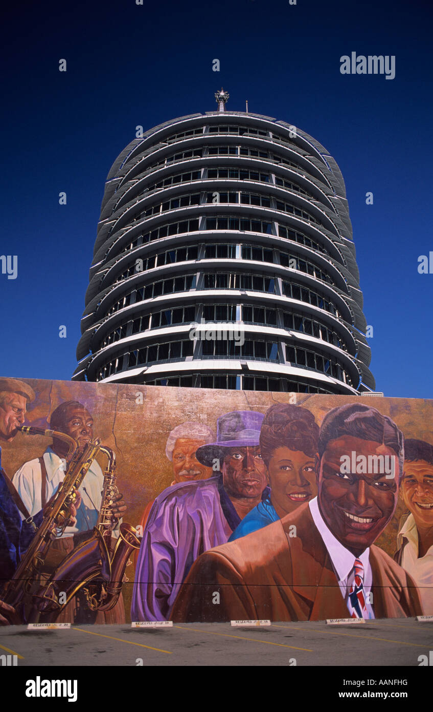 Capitol Records building with musicians mural in foreground parking lot ...