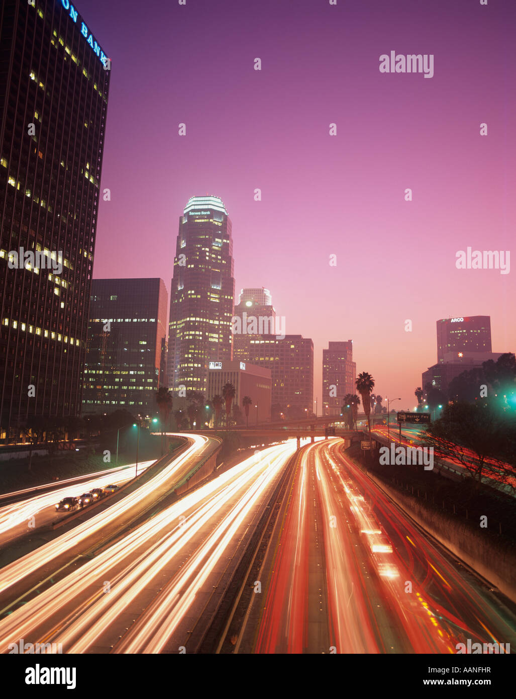 Retro image Rush hour downtown LA with car light streaks along freeway ...