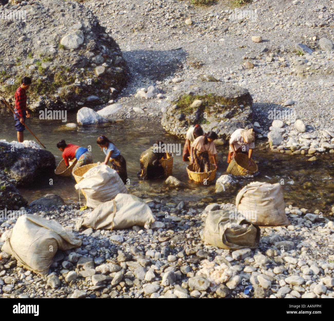 Women washing in river hi-res stock photography and images - Alamy