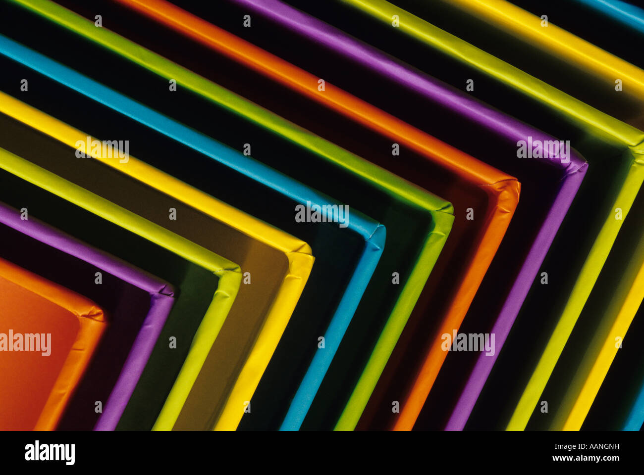 Colorful boxes laid out and evenly spaced creating a colorful pattern ...