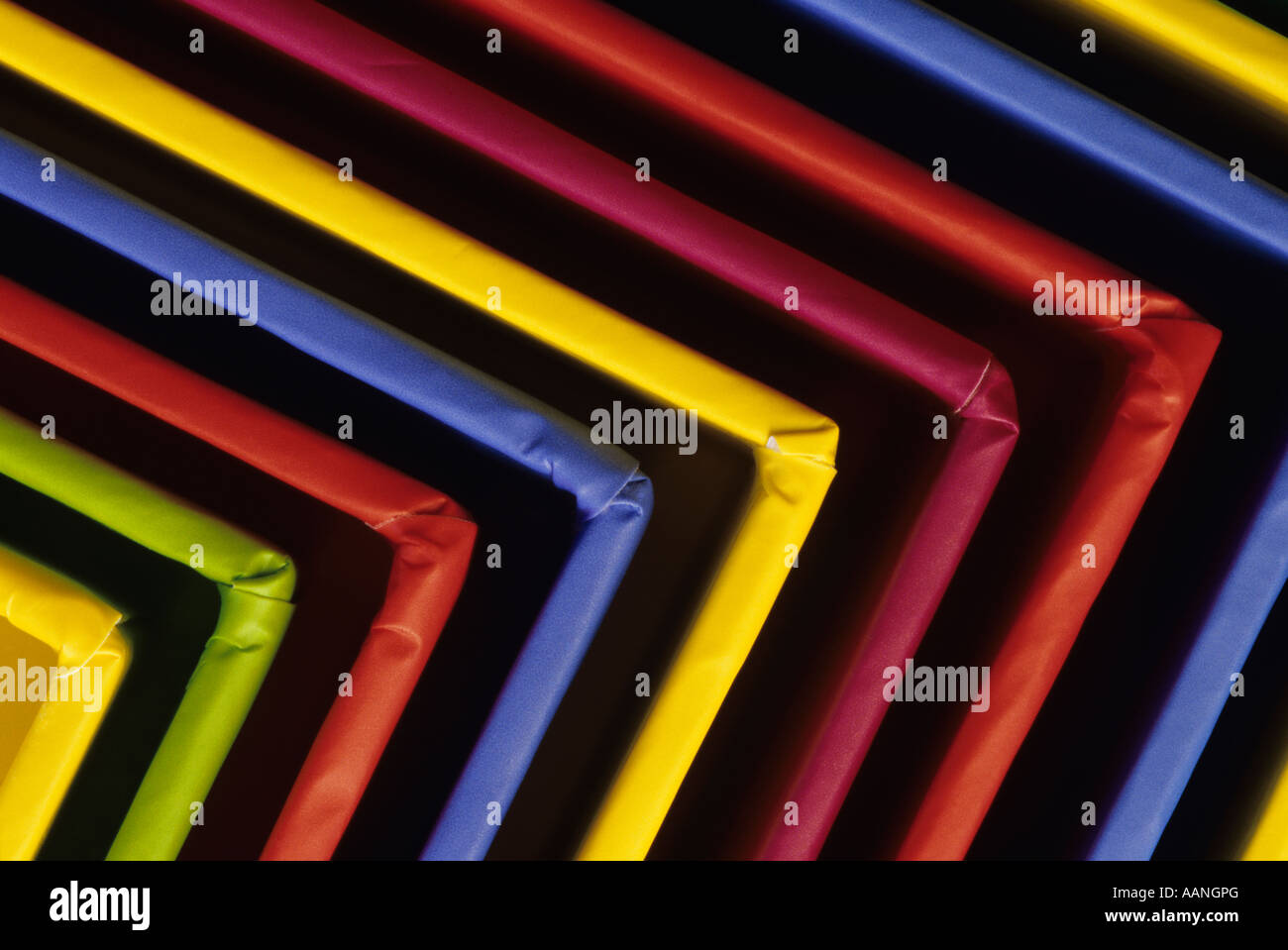 Colorful boxes laid out and evenly spaced creating a colorful pattern ...