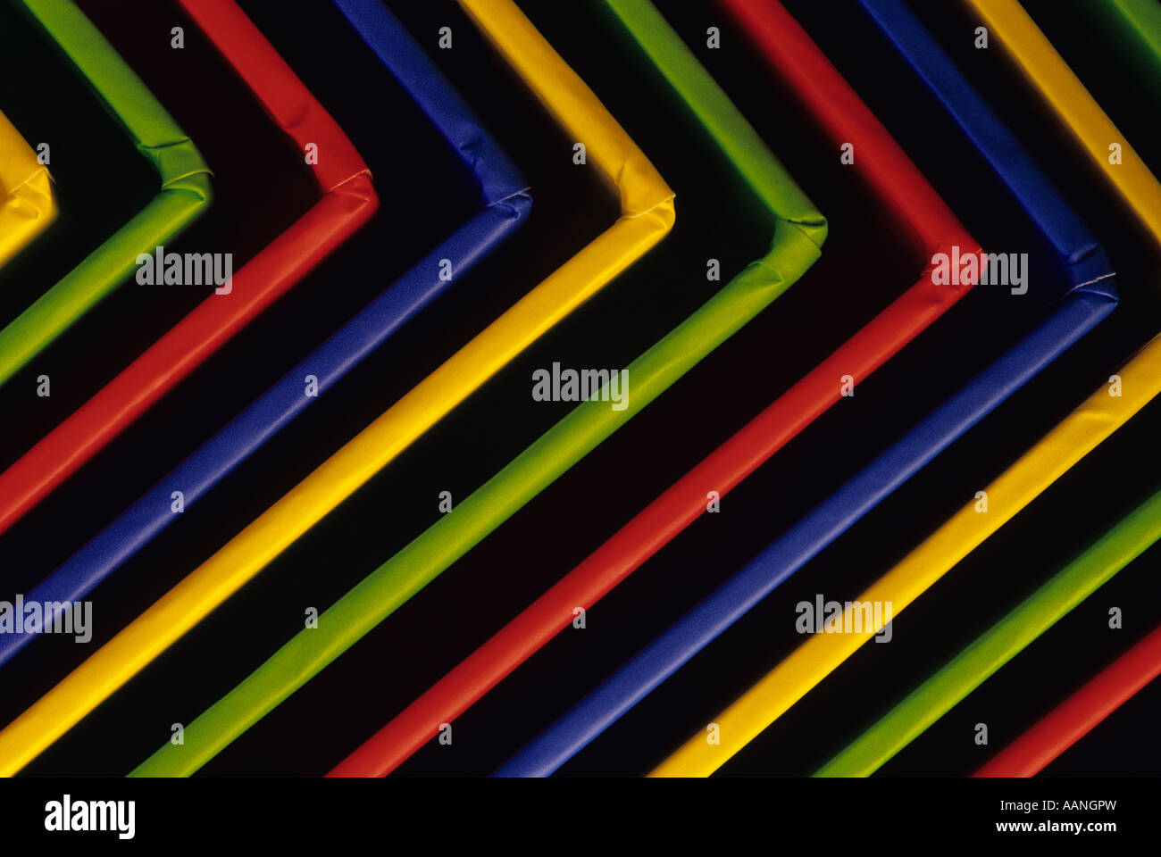 Colorful boxes laid out and evenly spaced creating a colorful pattern ...