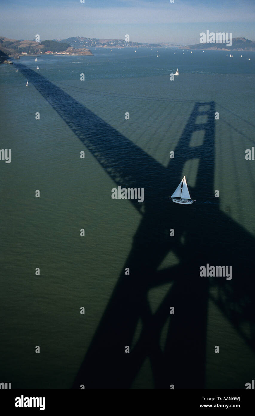 Golden Gate Bridge shadow on San Francisco Bay with sailboats in bay ...