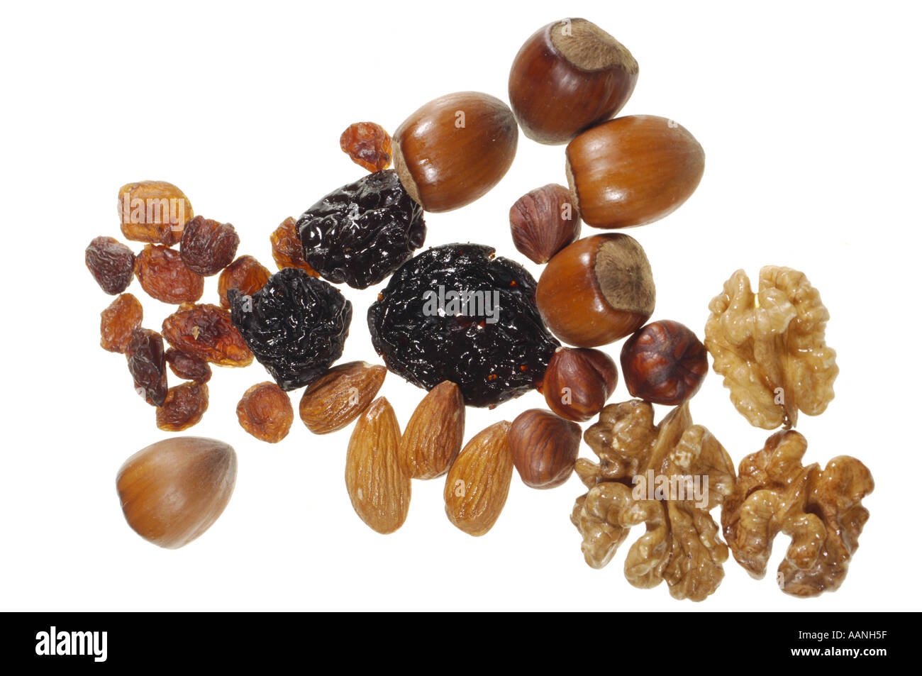 Assorted nuts and dried prunes on a white background Stock Photo - Alamy