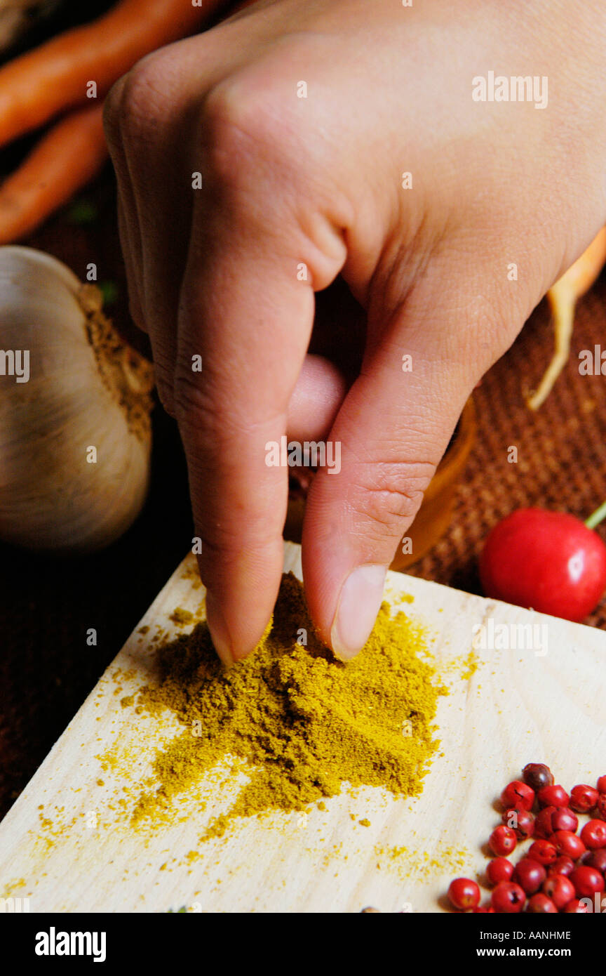 Hand holding curry Stock Photo - Alamy