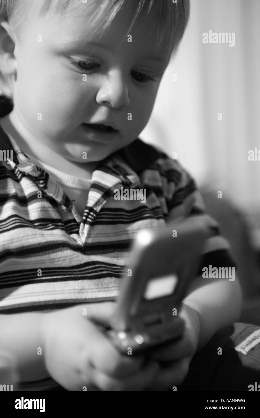 toddler using mobile phone to text Stock Photo - Alamy