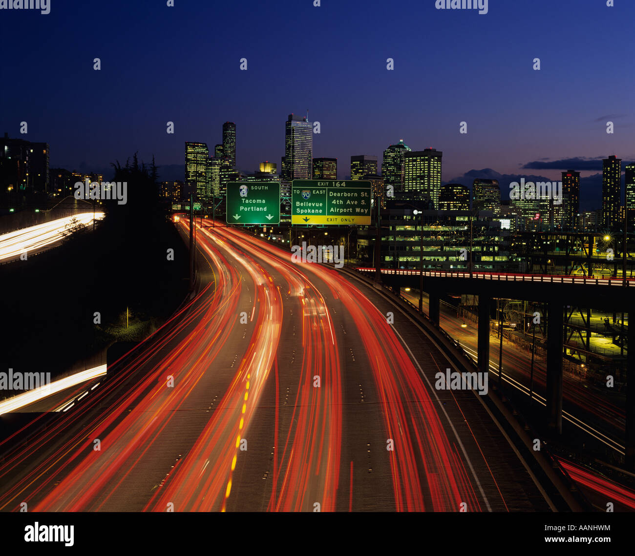 Retro image of Seattle skyline illuminated at dusk with city lights and ...