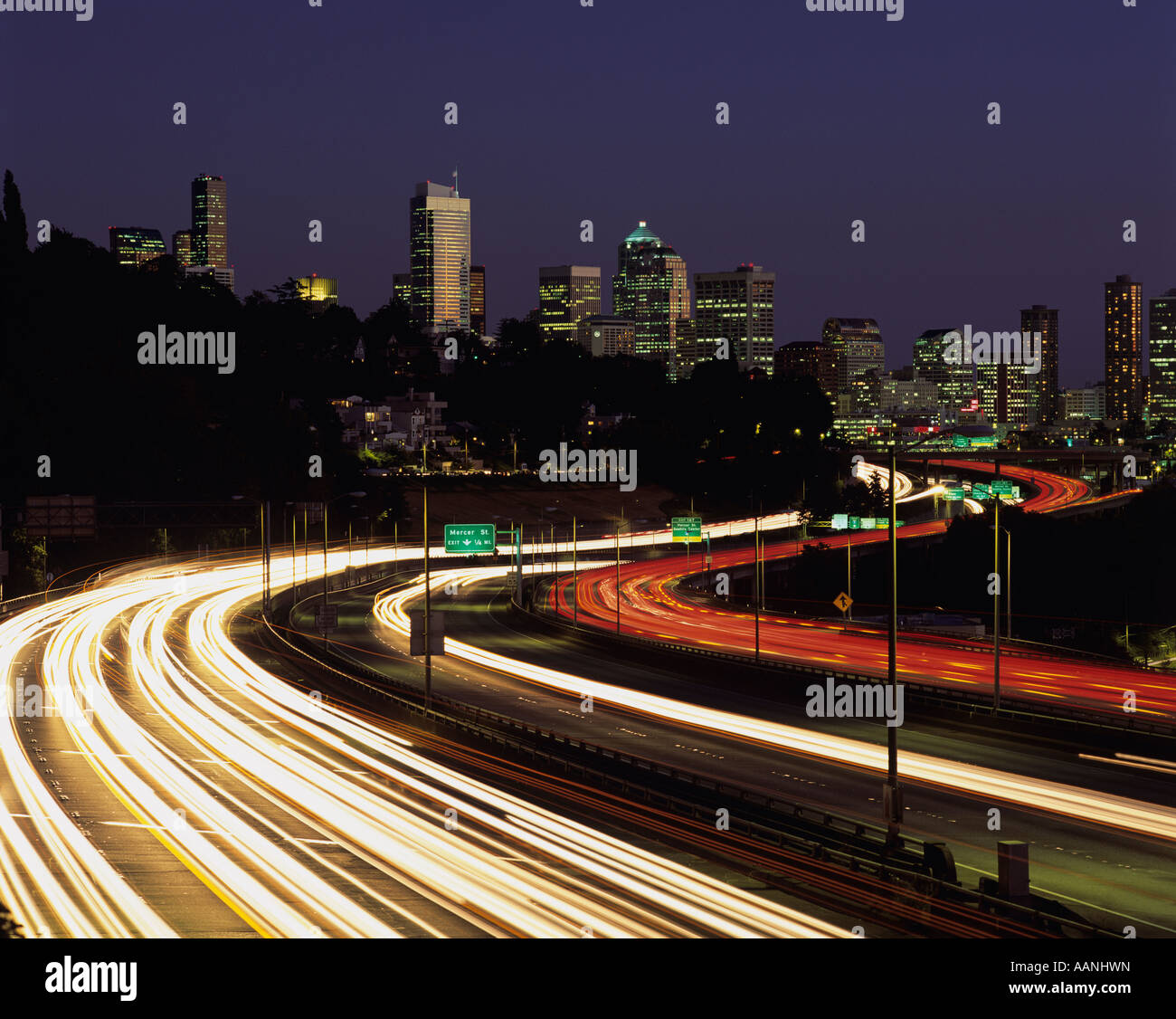 Retro image of Seattle skyline illuminated at dusk with city lights and ...