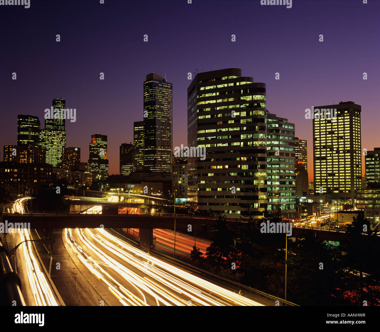 Retro image of Seattle skyline illuminated at dusk with city lights and ...