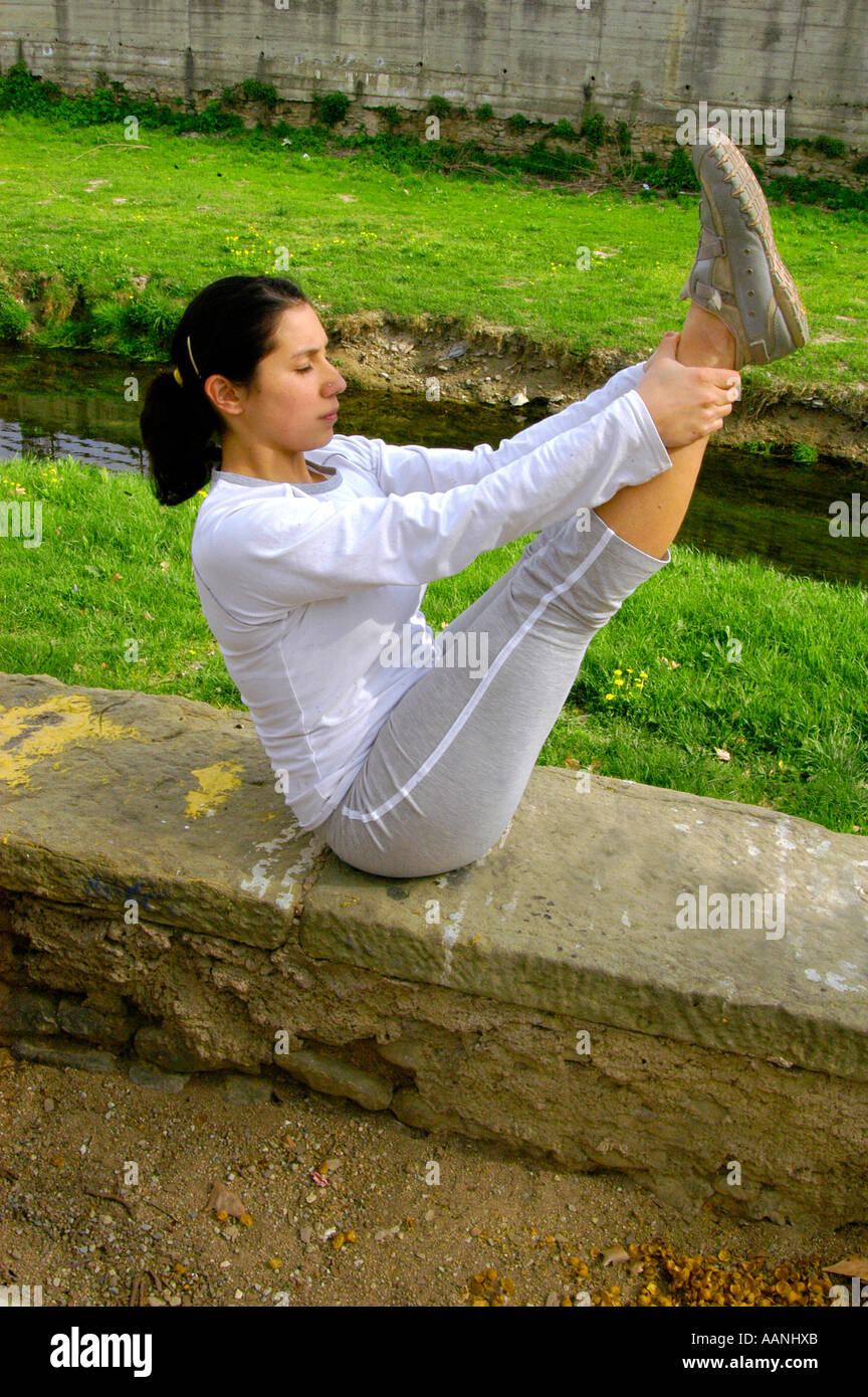 MODEL RELEASED Young woman practicing Pilates V pose Nano Calvo VWPics ...