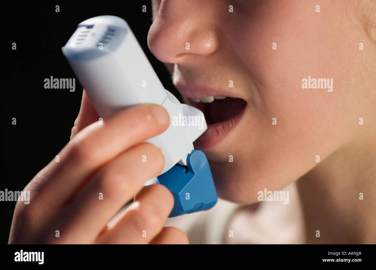 Blue Salbutamol inhaler for Asthma relief used by girl Stock Photo - Alamy