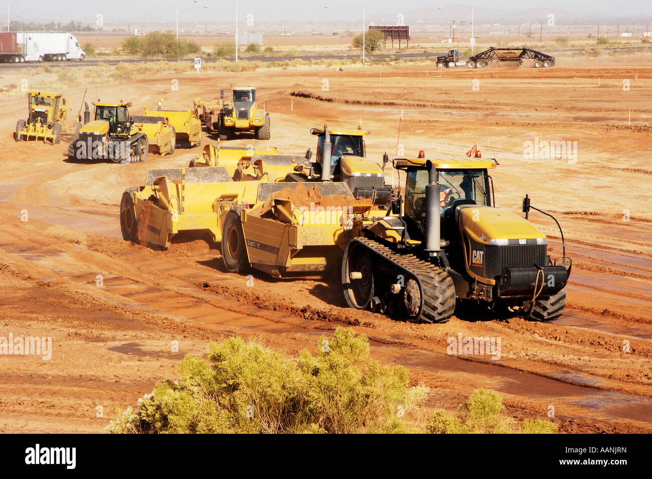 earthmoving equipment at work preparing a construction site for ...