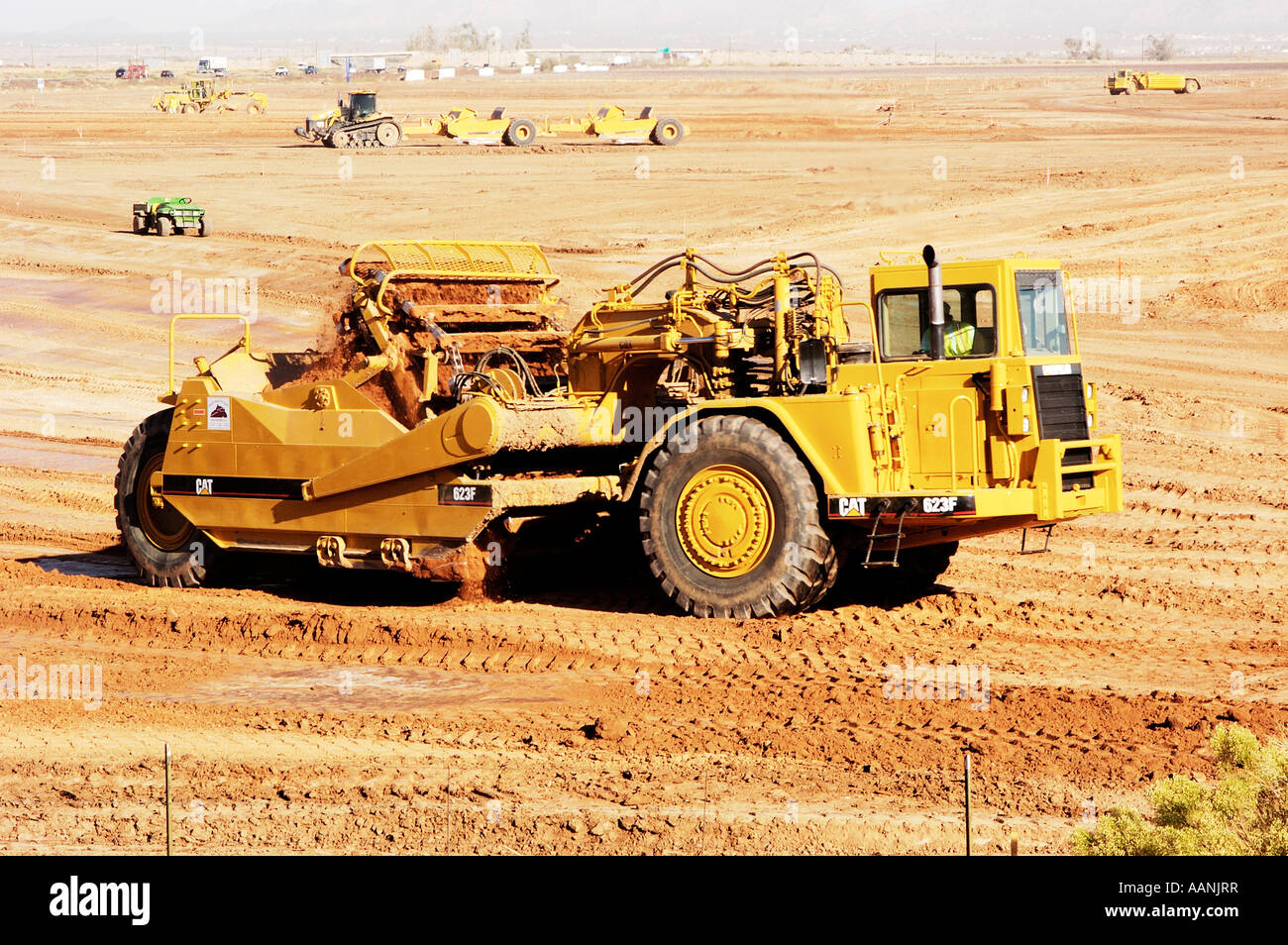 earthmoving equipment at work preparing a construction site for ...