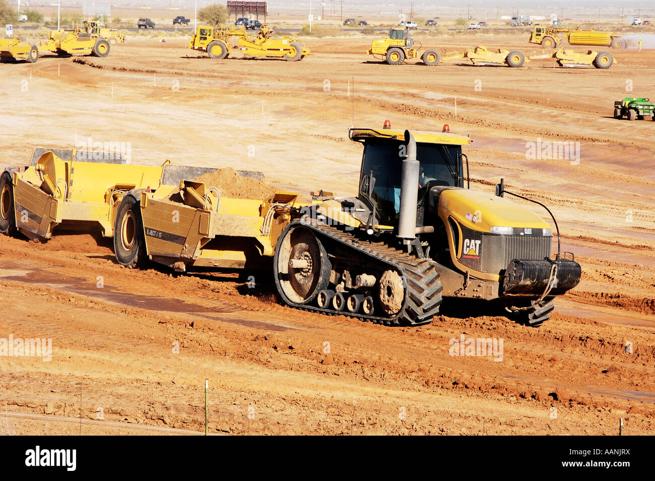 earthmoving equipment at work preparing a construction site for ...