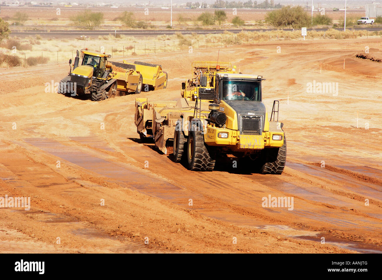 earthmoving equipment at work preparing a construction site for ...