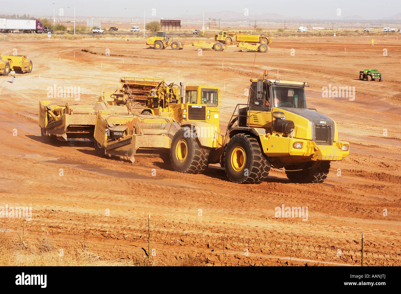earthmoving equipment at work preparing a construction site for ...