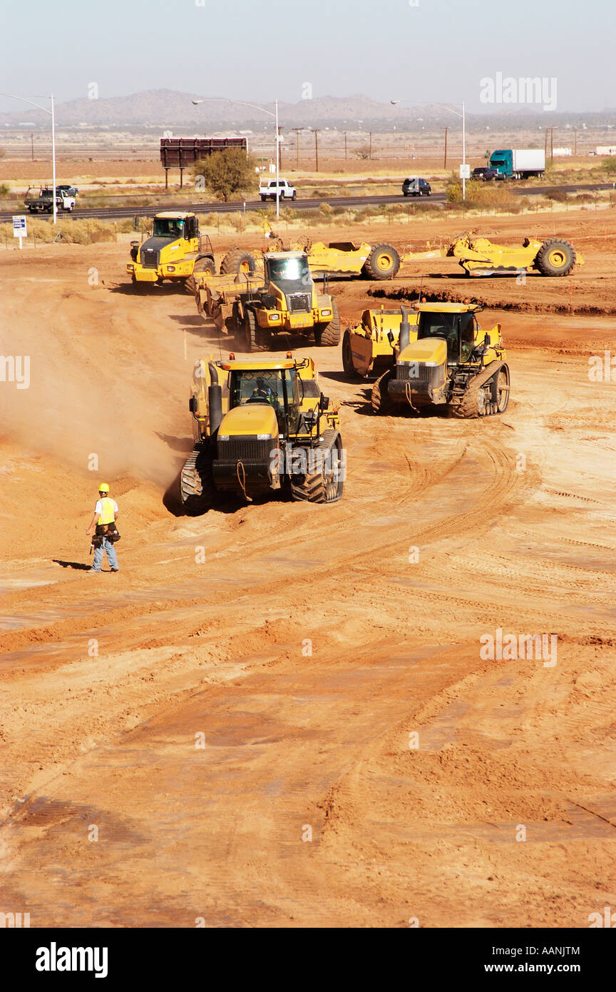 earthmoving equipment at work preparing a construction site for ...